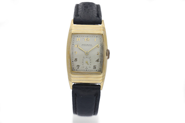 Bonhams : Movado. A 14K Yellow Gold Curved Rectangular Wristwatch