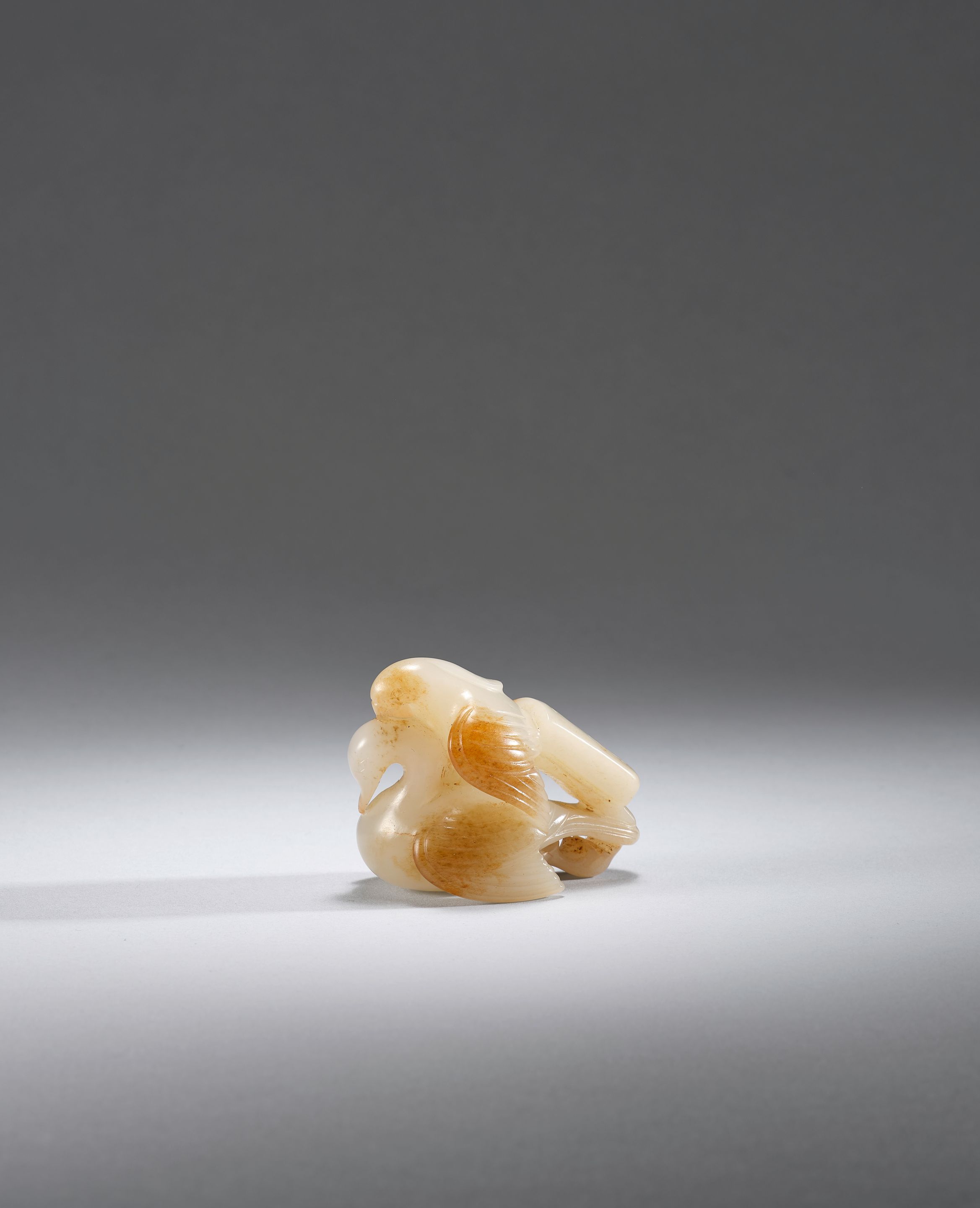 Bonhams : A RARE WHITE AND RUSSET JADE 'FALCON AND SWAN' GROUP Ming Dynasty
